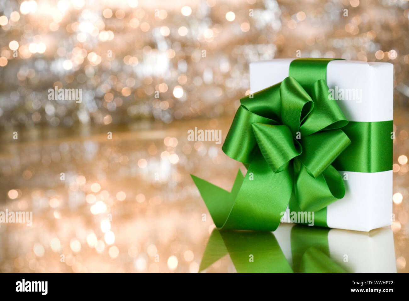 Present with green ribbon Stock Photo - Alamy