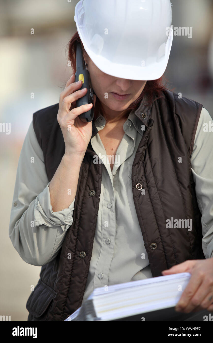 Female foreman with radio receiver Stock Photo - Alamy