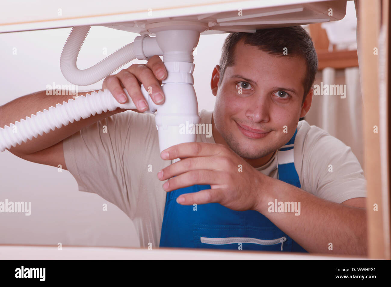 portrait of a young plumber Stock Photo - Alamy