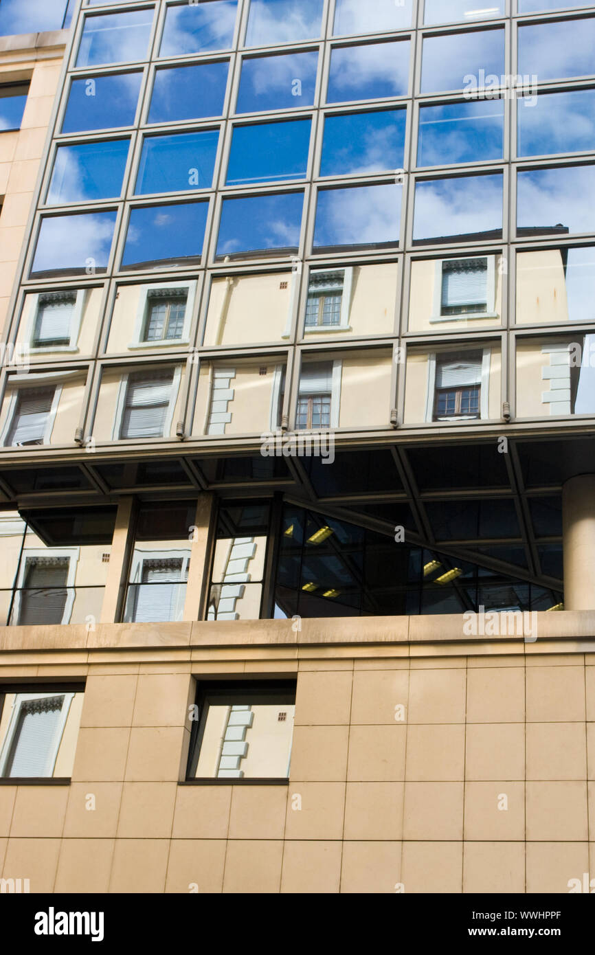 Old house reflected in office building windows Stock Photo - Alamy