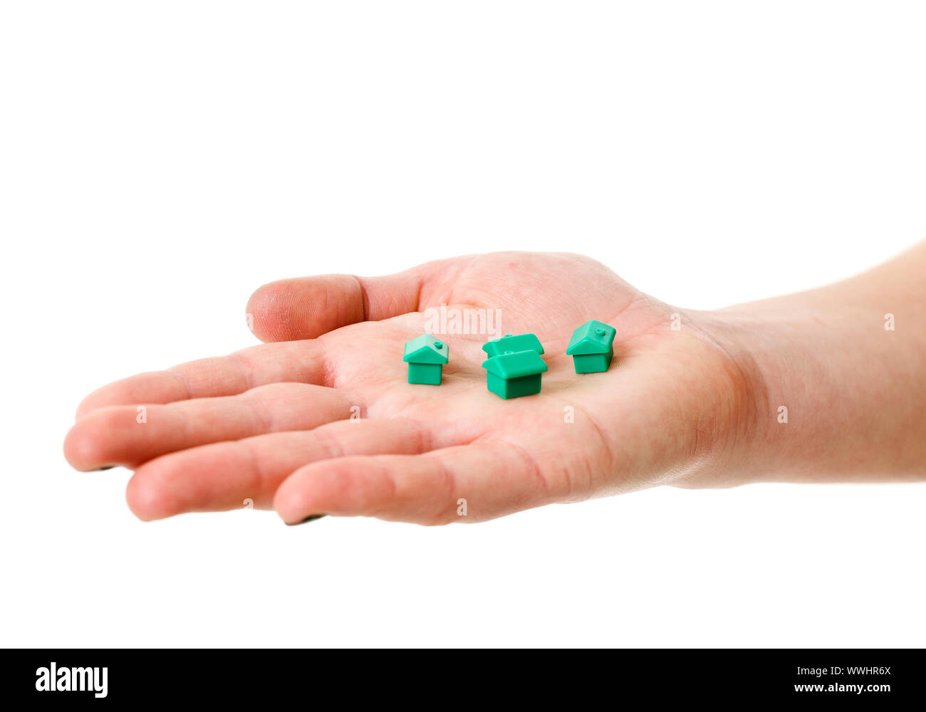 Open hand with Toy house isolated on white background Stock Photo - Alamy