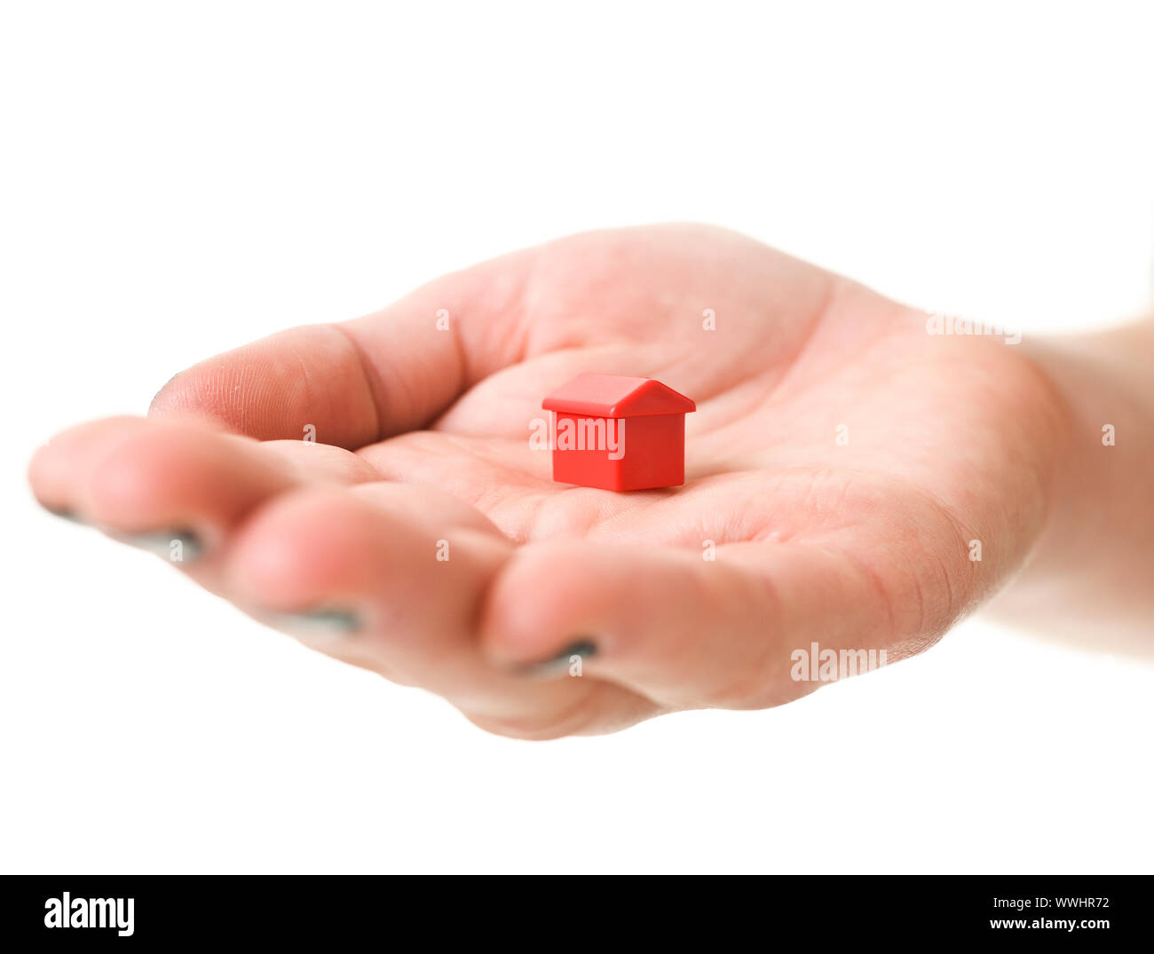 Open hand with Toy house isolated on white background Stock Photo - Alamy