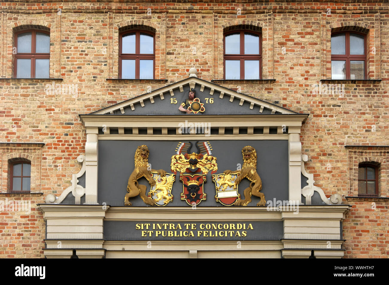 Stone gate, inscription and coat of arms, Rostock Stock Photo - Alamy
