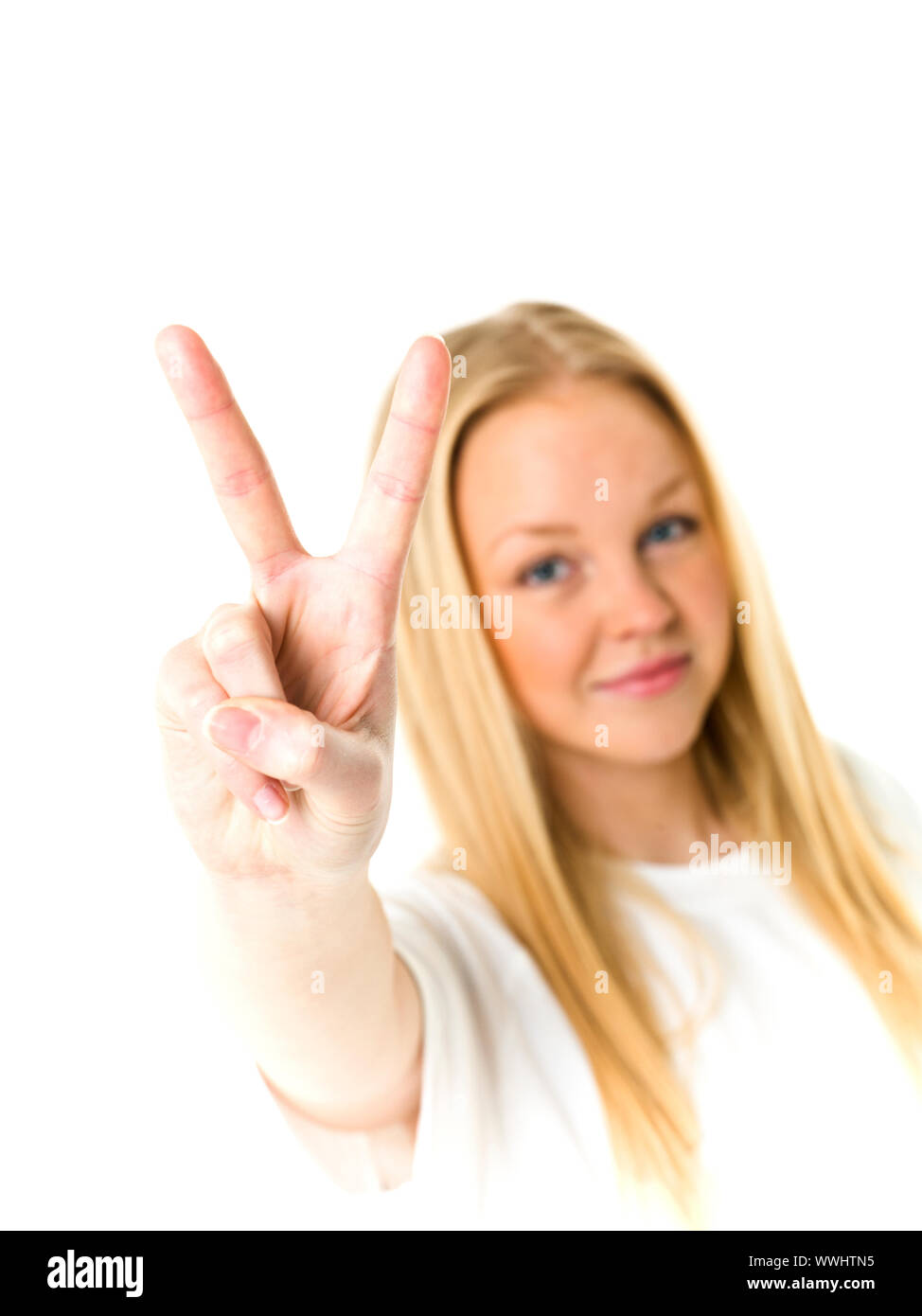 Young woman doing v-sign isolated on white background Stock Photo - Alamy