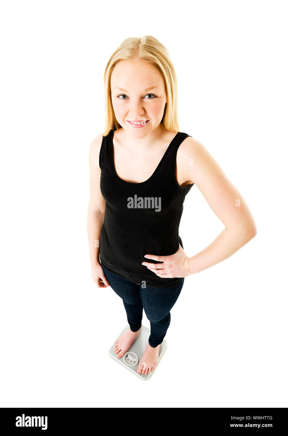 Young Girl on weight scale isolated on white background Stock Photo - Alamy