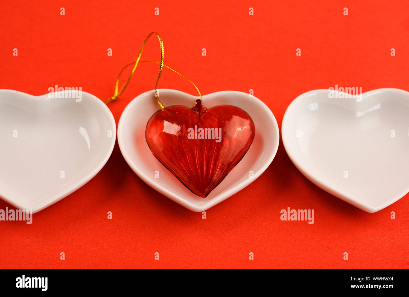 Red heart and heart shaped plates Stock Photo - Alamy
