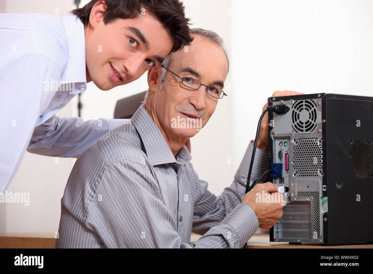 Father and son fixing a computer Stock Photo - Alamy