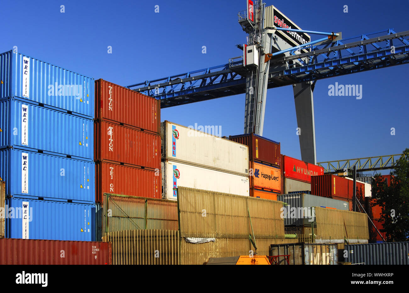 Container stack and trolley Stock Photo - Alamy