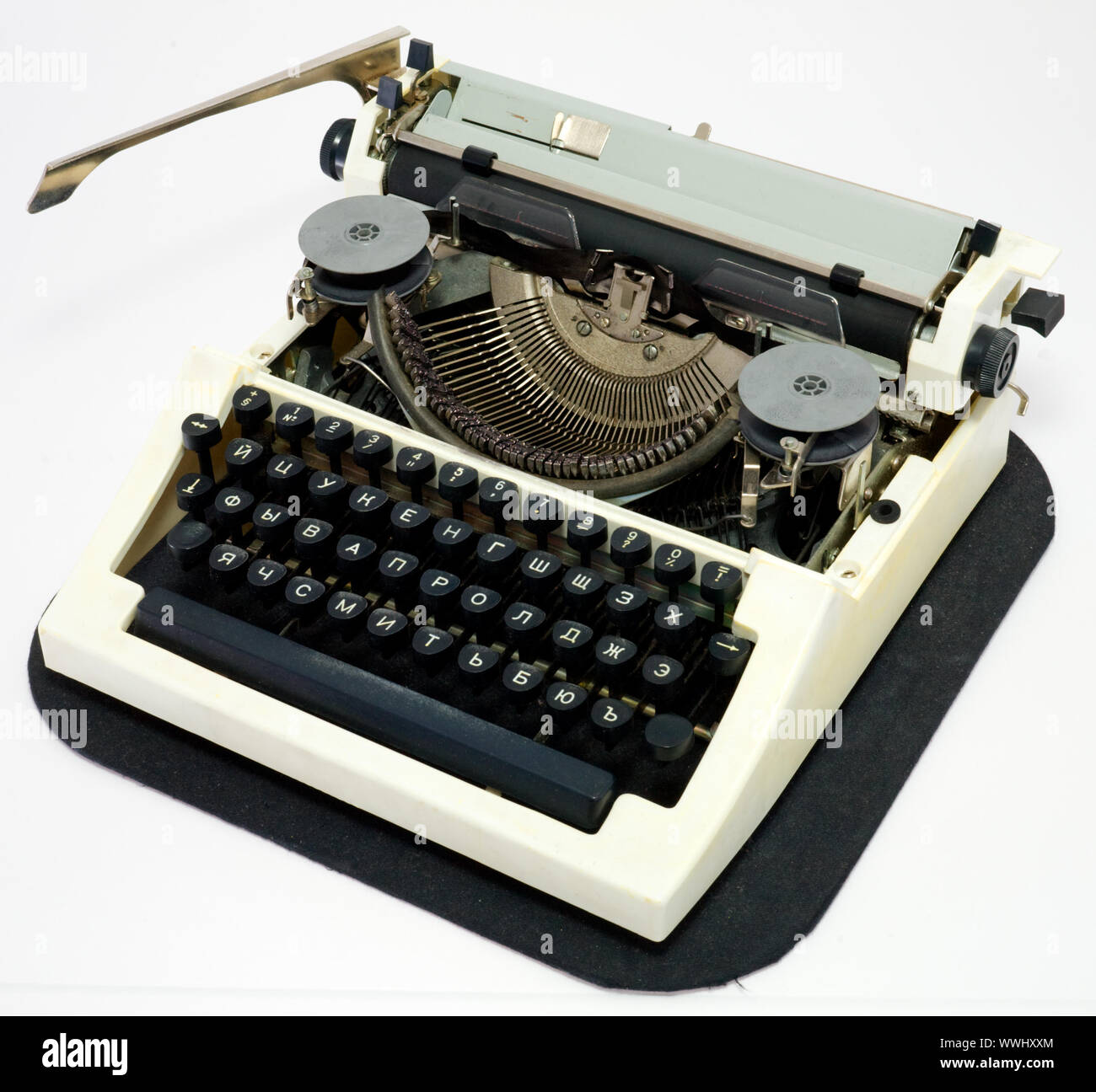 Old ancient typewriter on a white background Stock Photo - Alamy