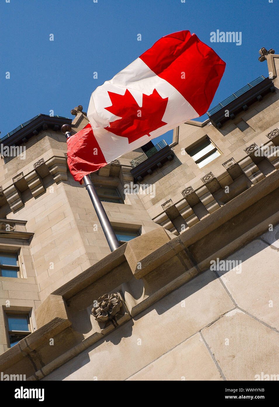 Building with the Canadian flag in the wind Stock Photo - Alamy