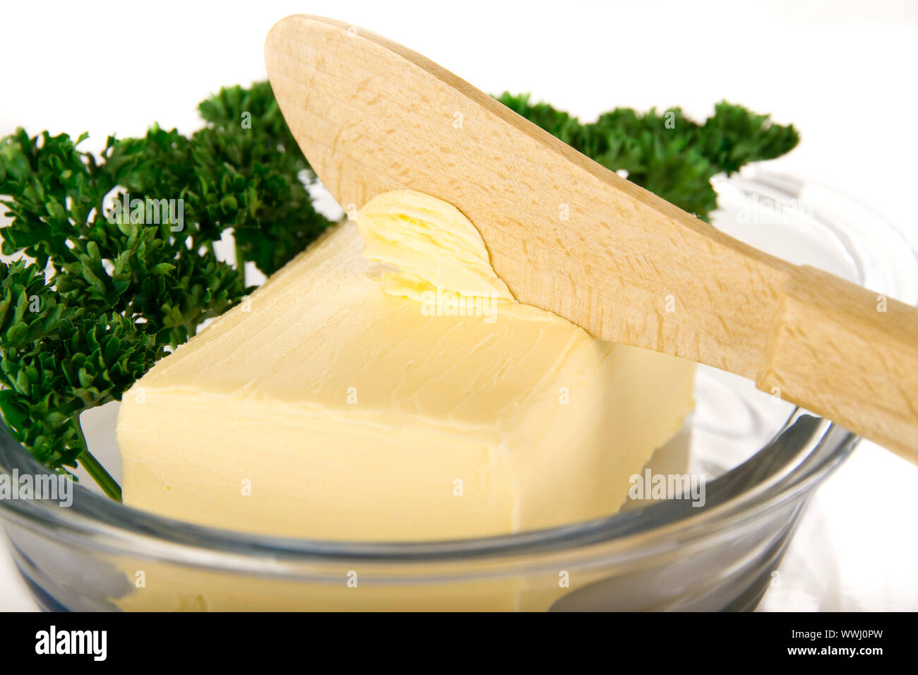 Butter with knife on the plate - isolated Stock Photo - Alamy