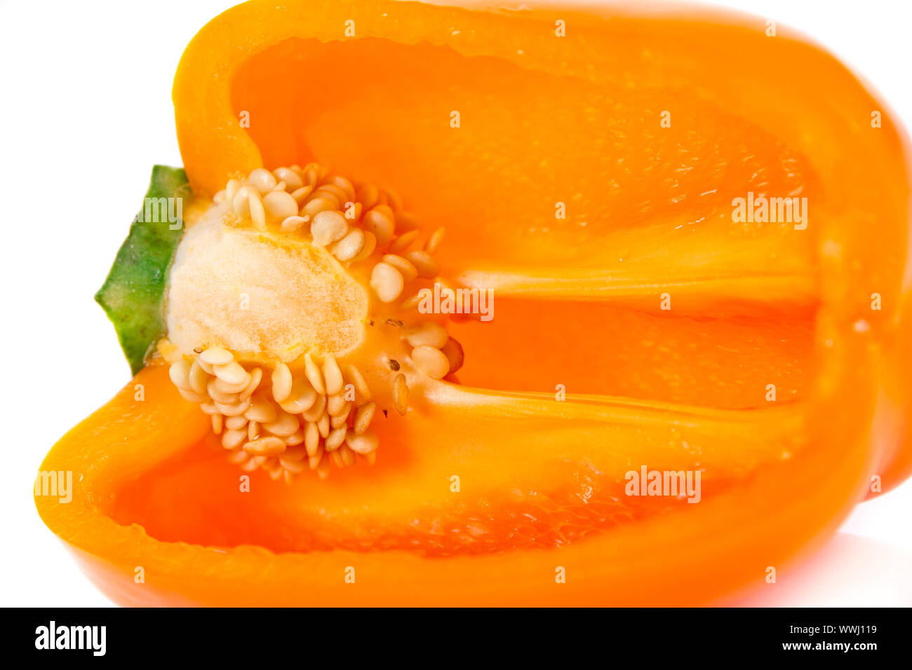 Ripped orange pepper isolated over white Stock Photo - Alamy
