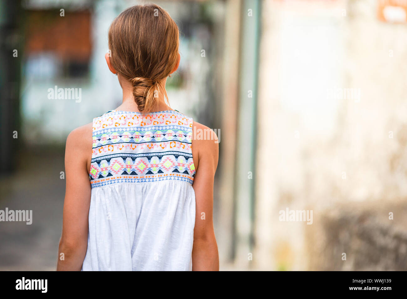 Adorable little girl in old streets in Italy. Happy toodler kids enjoy ...