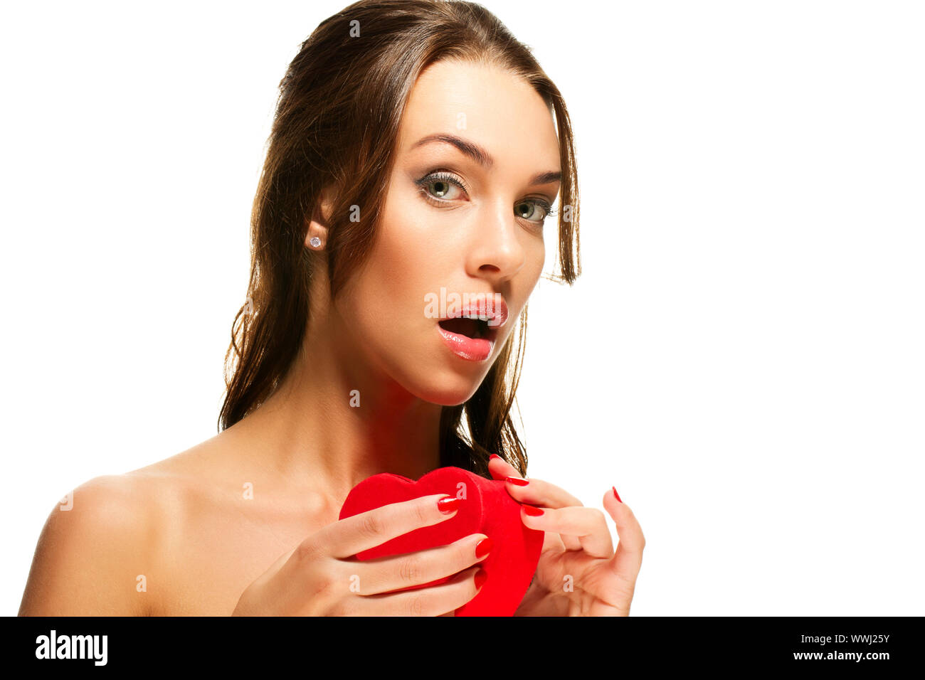 beautiful woman about to open a red heart shaped box on white ...