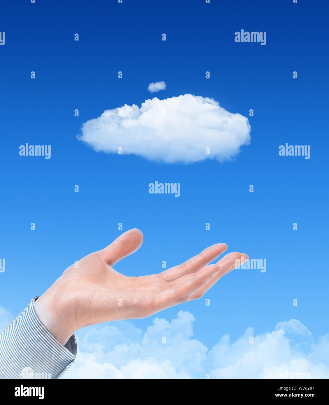 Man hand propose cloud against blue sky with clouds on background ...