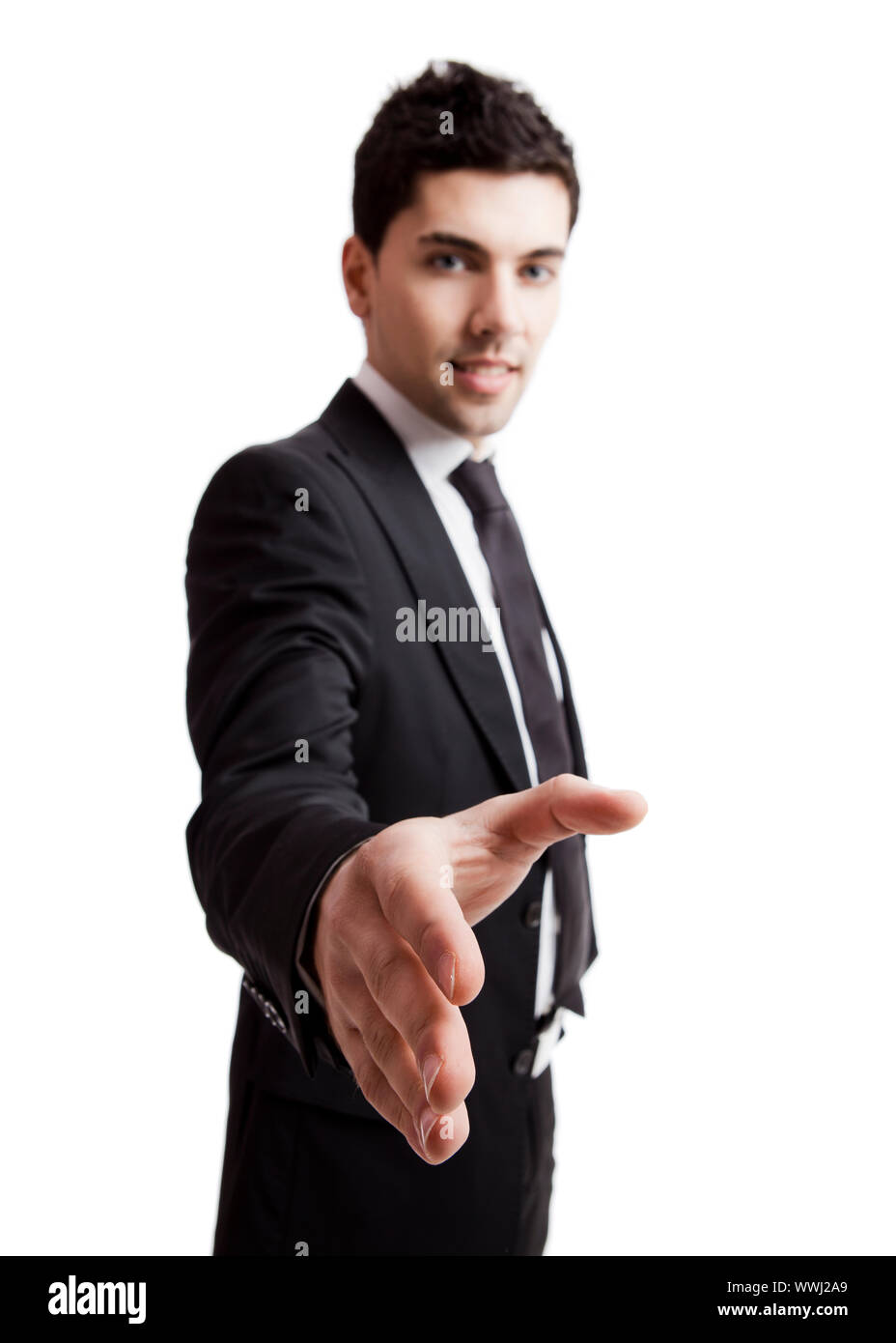 Young businessman giving handshake up isolated over a white background ...