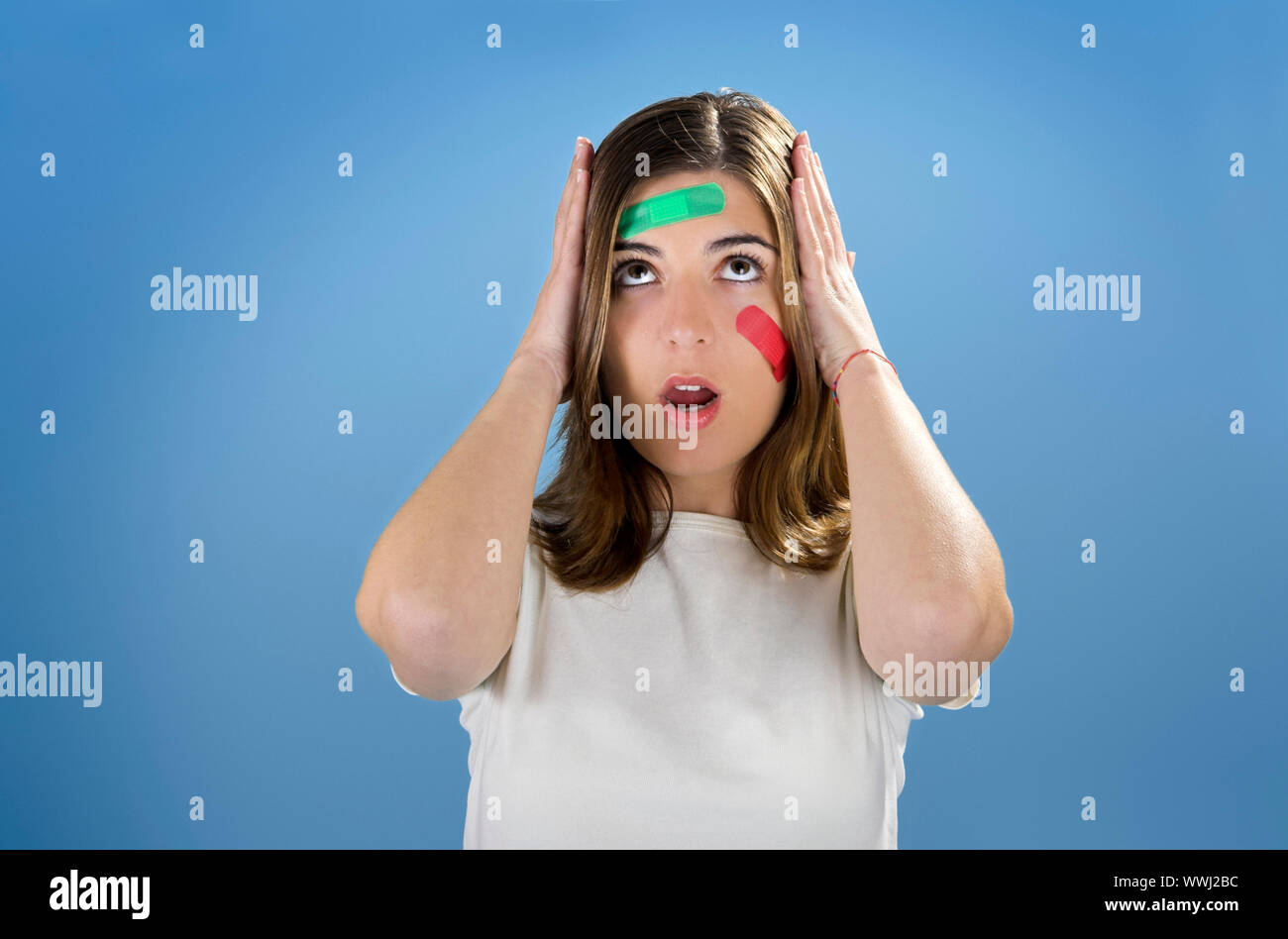Beautiful woman worried about her injuries on the face Stock Photo - Alamy