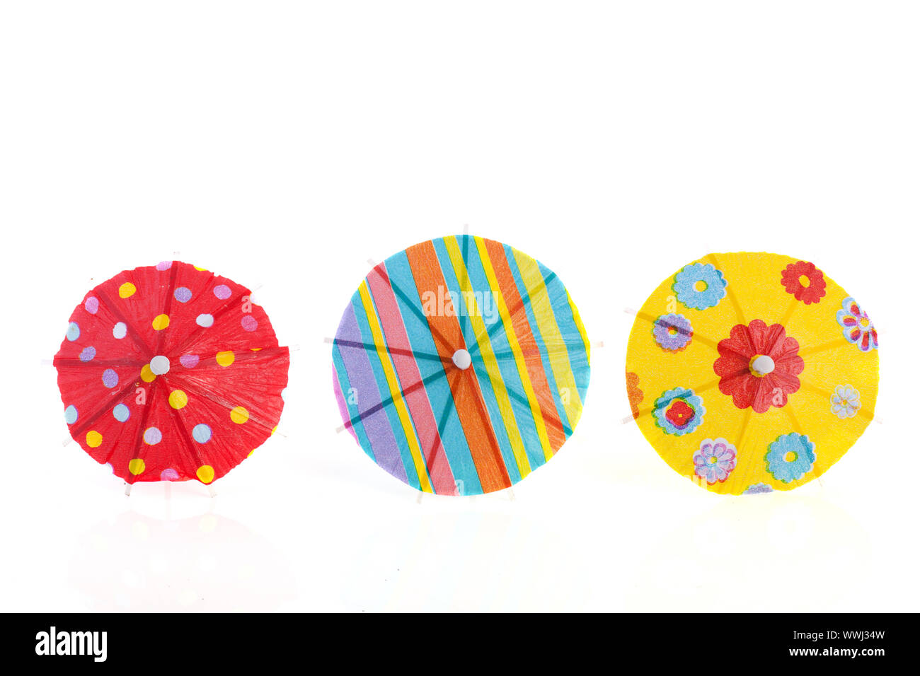 Row colorful summer parasols on white background Stock Photo - Alamy