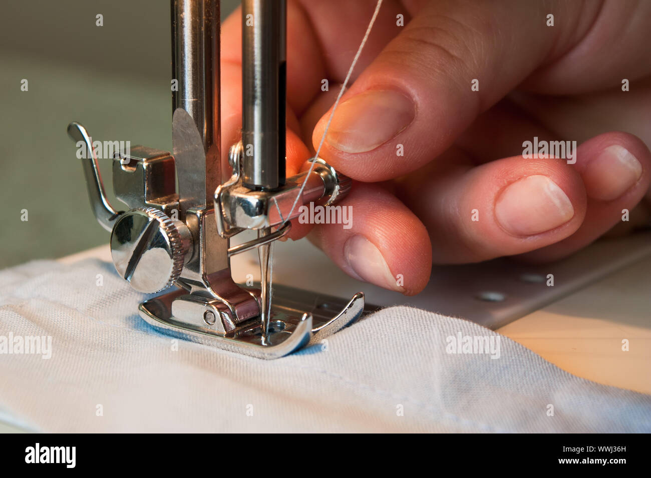 sewing machine and item of clothing Stock Photo - Alamy