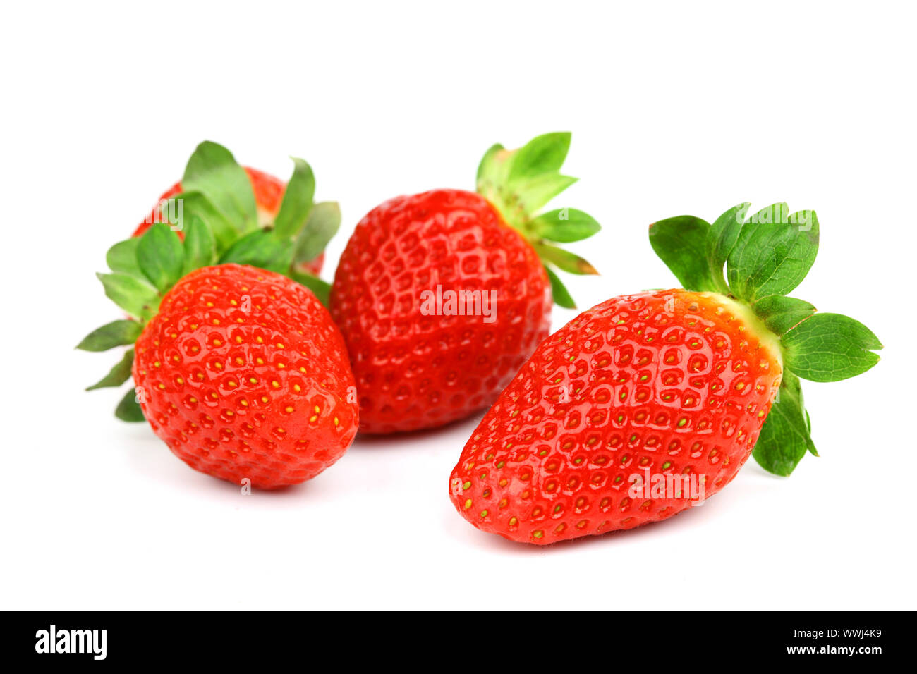 strawberry pile isolated on white background Stock Photo - Alamy