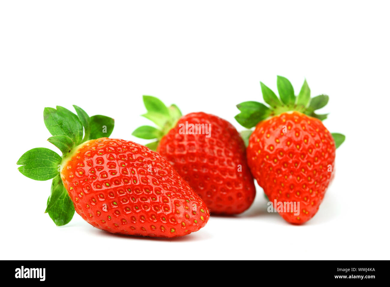 strawberry pile isolated on white background Stock Photo - Alamy