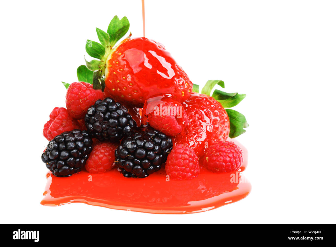 big berry pile in syrup isolated on white Stock Photo - Alamy