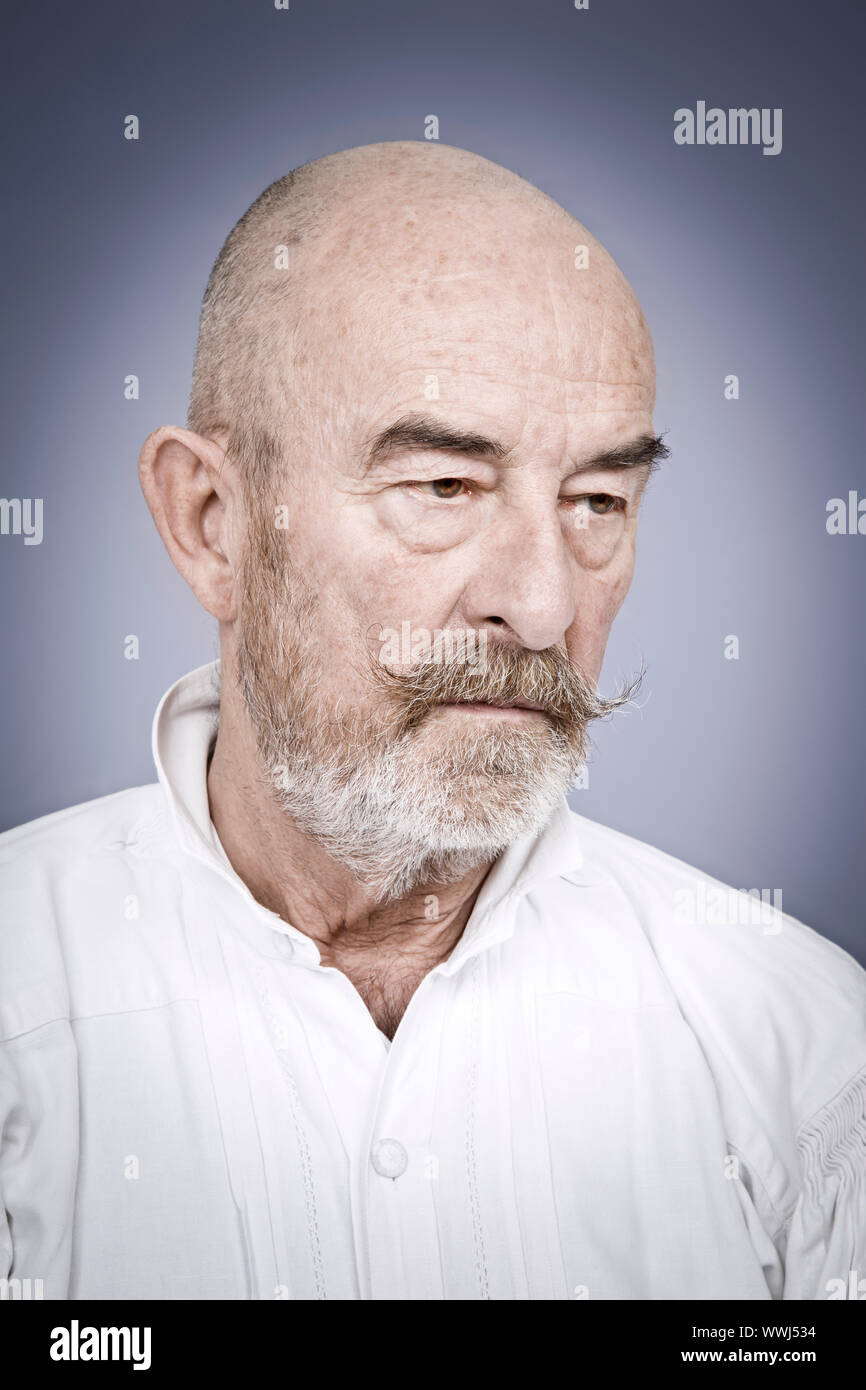 An old man with a grey beard is hopeless Stock Photo - Alamy