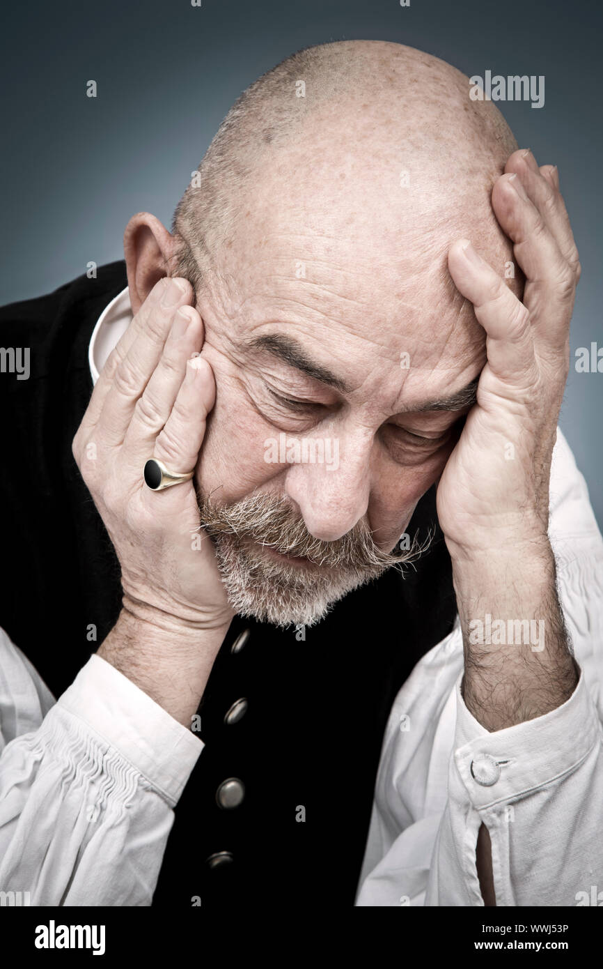 An old man with a grey beard is hopeless Stock Photo - Alamy