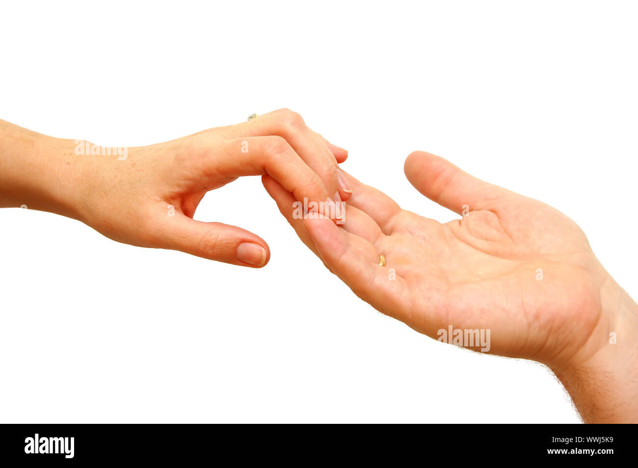 Two hands - woman and man touch each other in delicate, subtle way ...