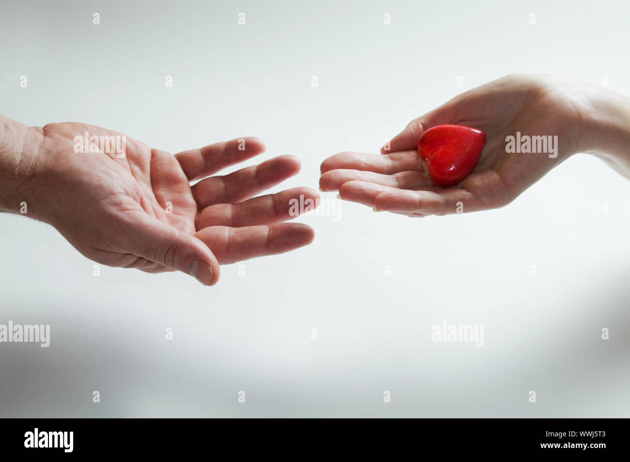 Hand gives another hi-res stock photography and images - Alamy