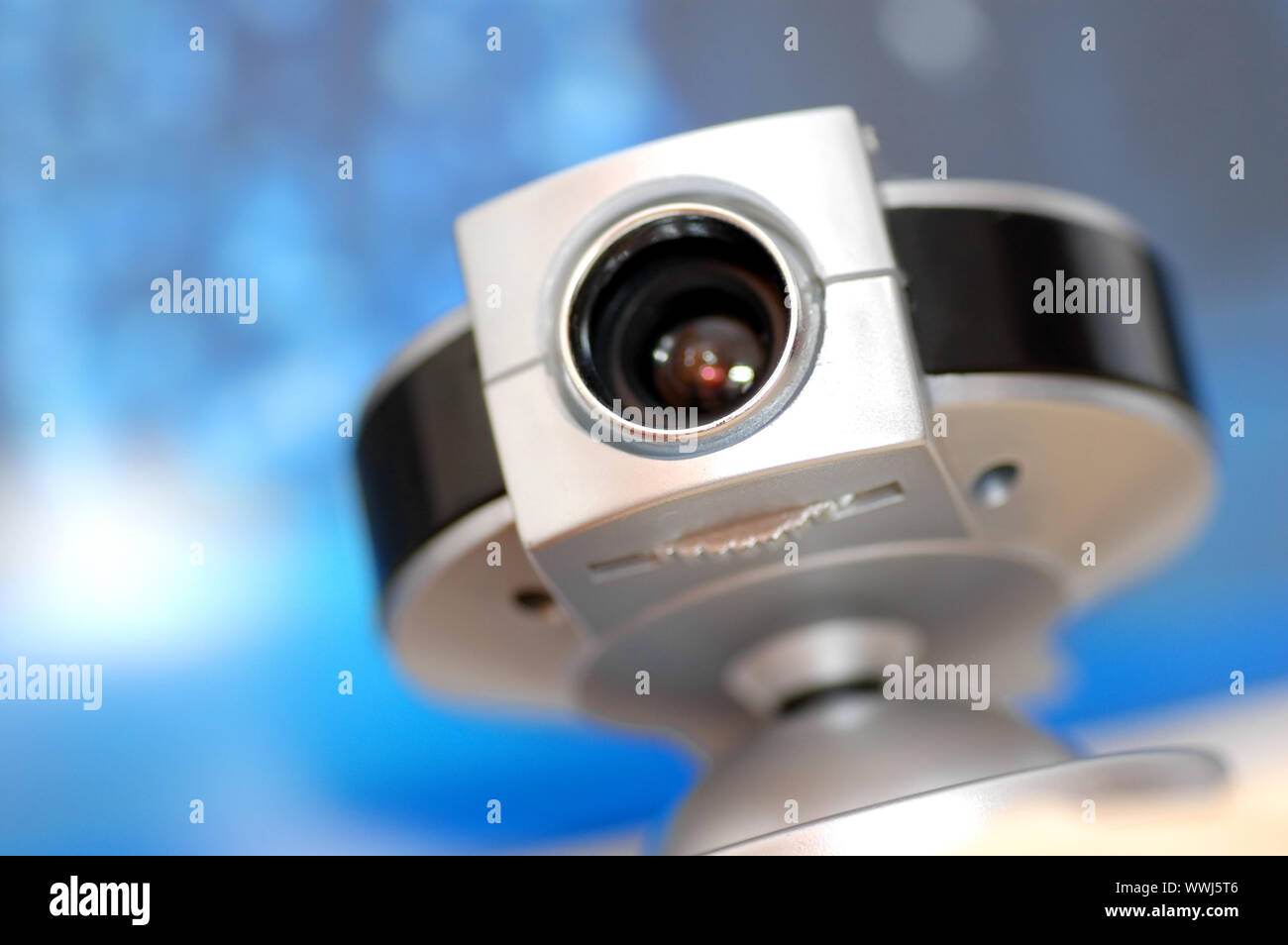 Web camera on blue, blured screen background Stock Photo - Alamy