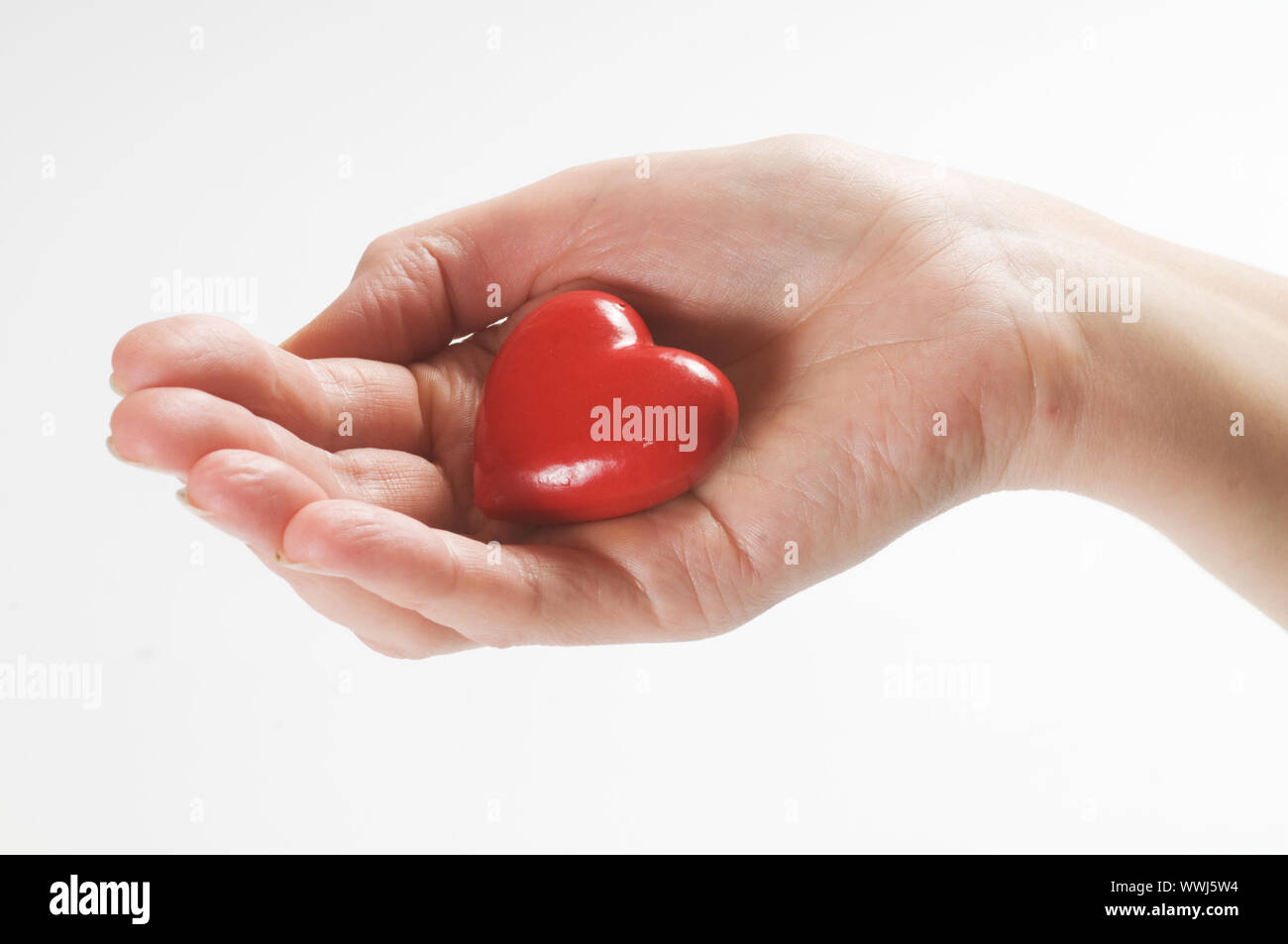 Heart in hand conceptual image. Love, care, health themes Stock Photo ...