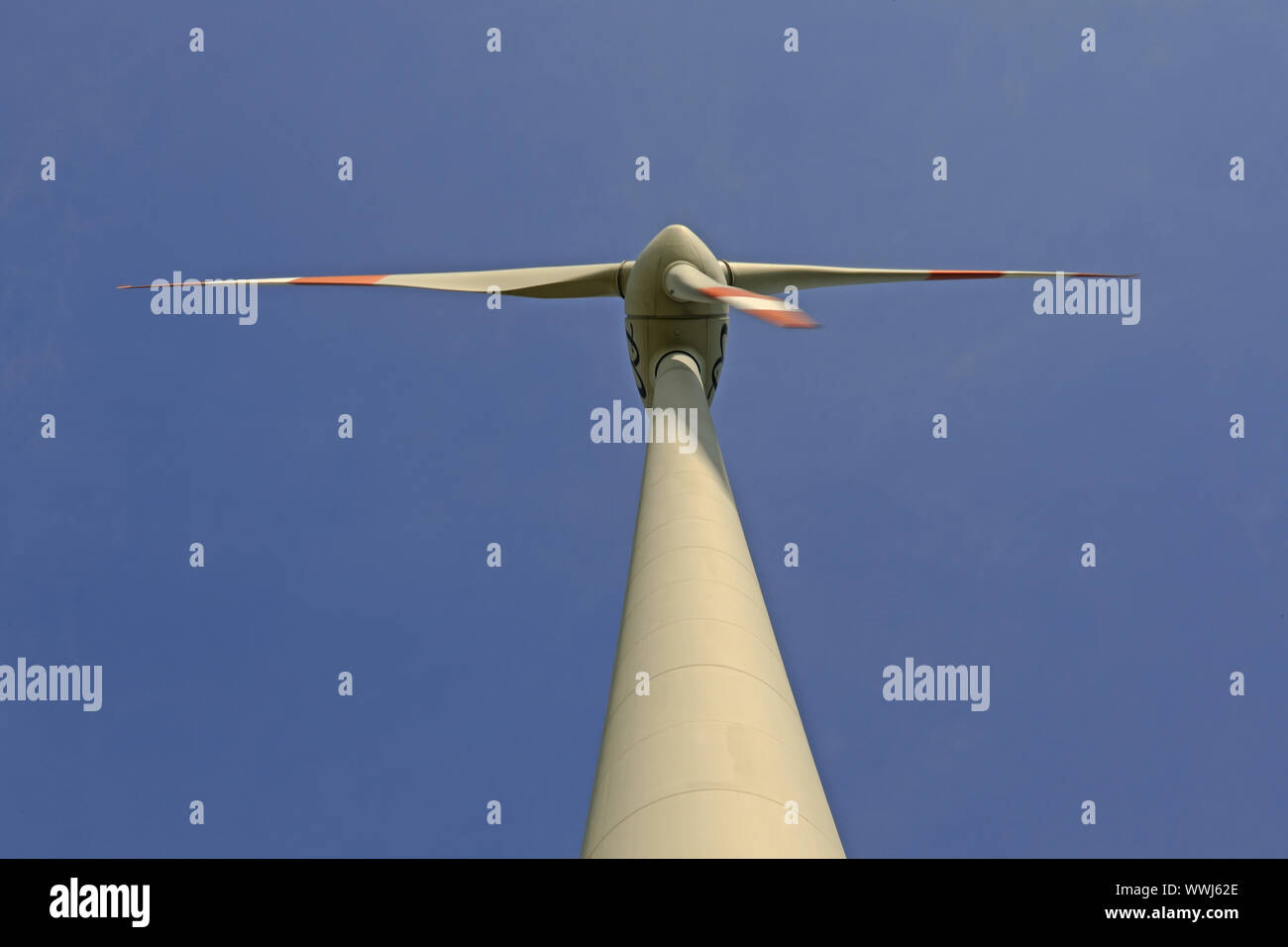 Wind turbine with rotating blades, motion blur Stock Photo - Alamy