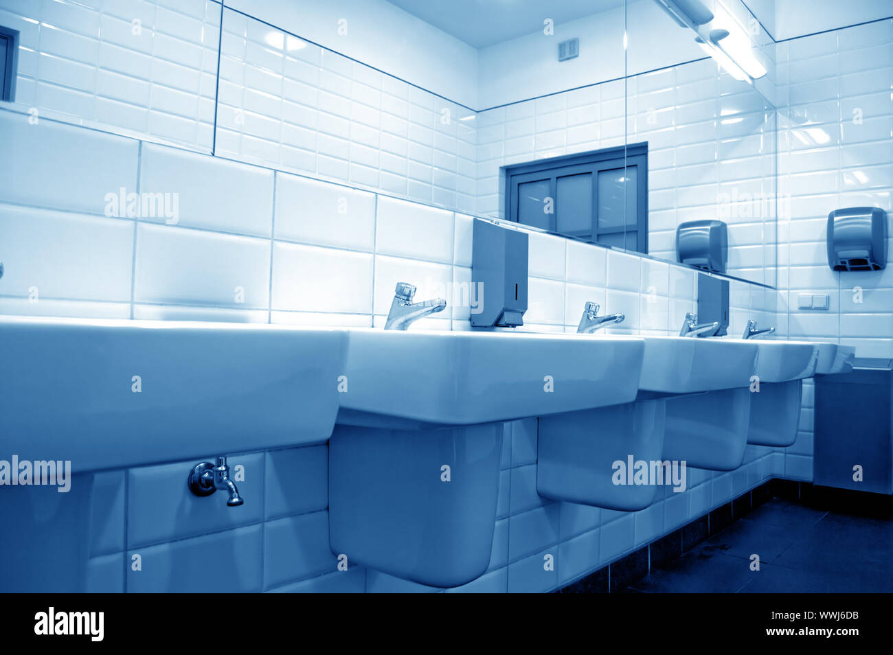 Public toilet with several sinks Stock Photo - Alamy