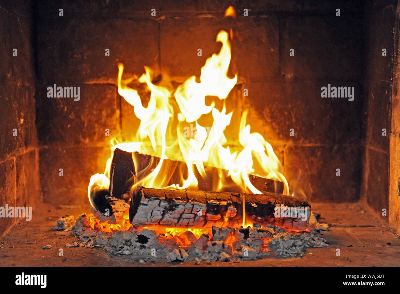 Wood fire in an open fireplace Stock Photo - Alamy