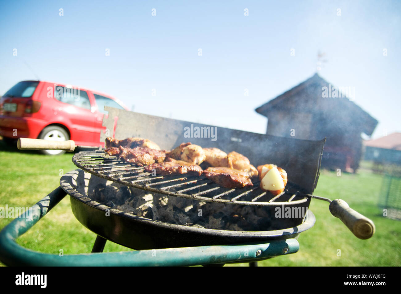 Cooking on the barbecue grill Stock Photo - Alamy