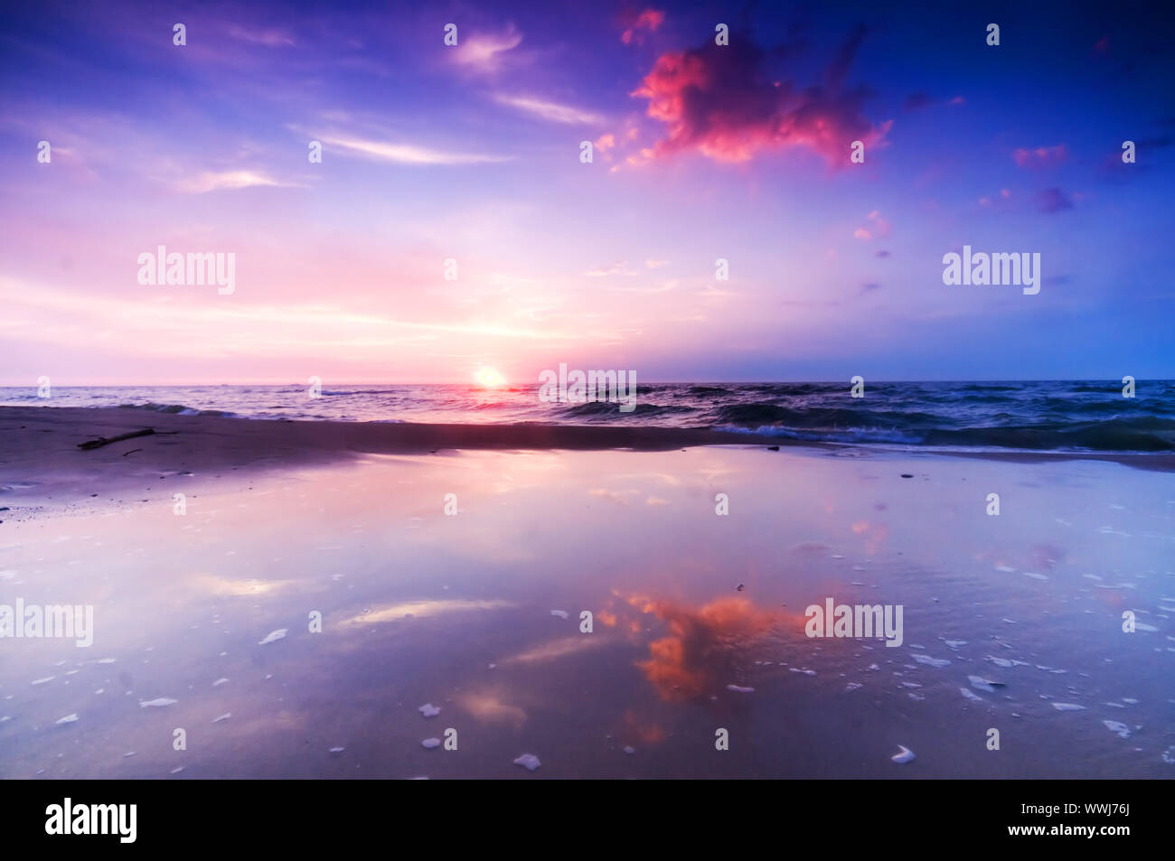 Beautiful sea sunrise. Colorful sky and water reflection Stock Photo ...