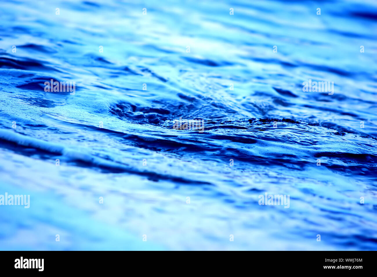 Blue, crystal water twirling, background Stock Photo - Alamy