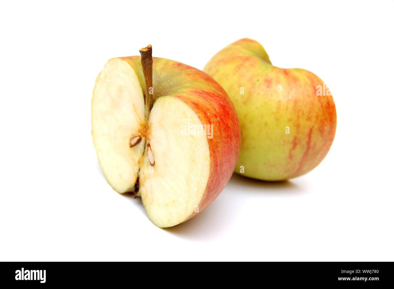 Two apple halves isolated on white Stock Photo - Alamy