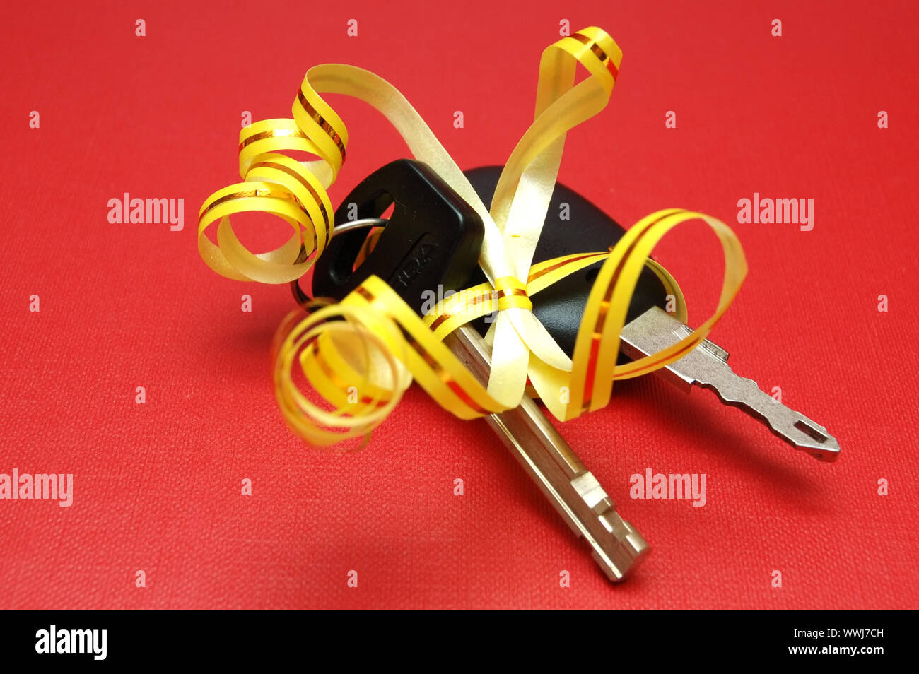 Car keys on red background Stock Photo - Alamy