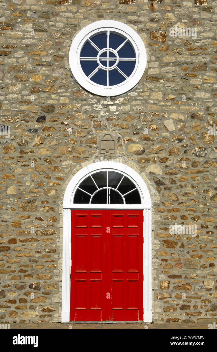 Red church door and round church window Stock Photo - Alamy