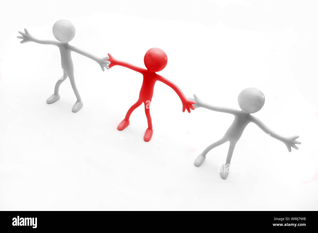 Teamwork concept. Three human figures together Stock Photo - Alamy