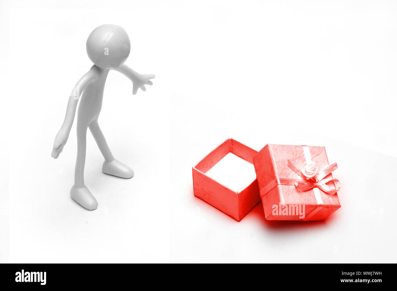 A gift and a human figure. Conceptual Stock Photo - Alamy