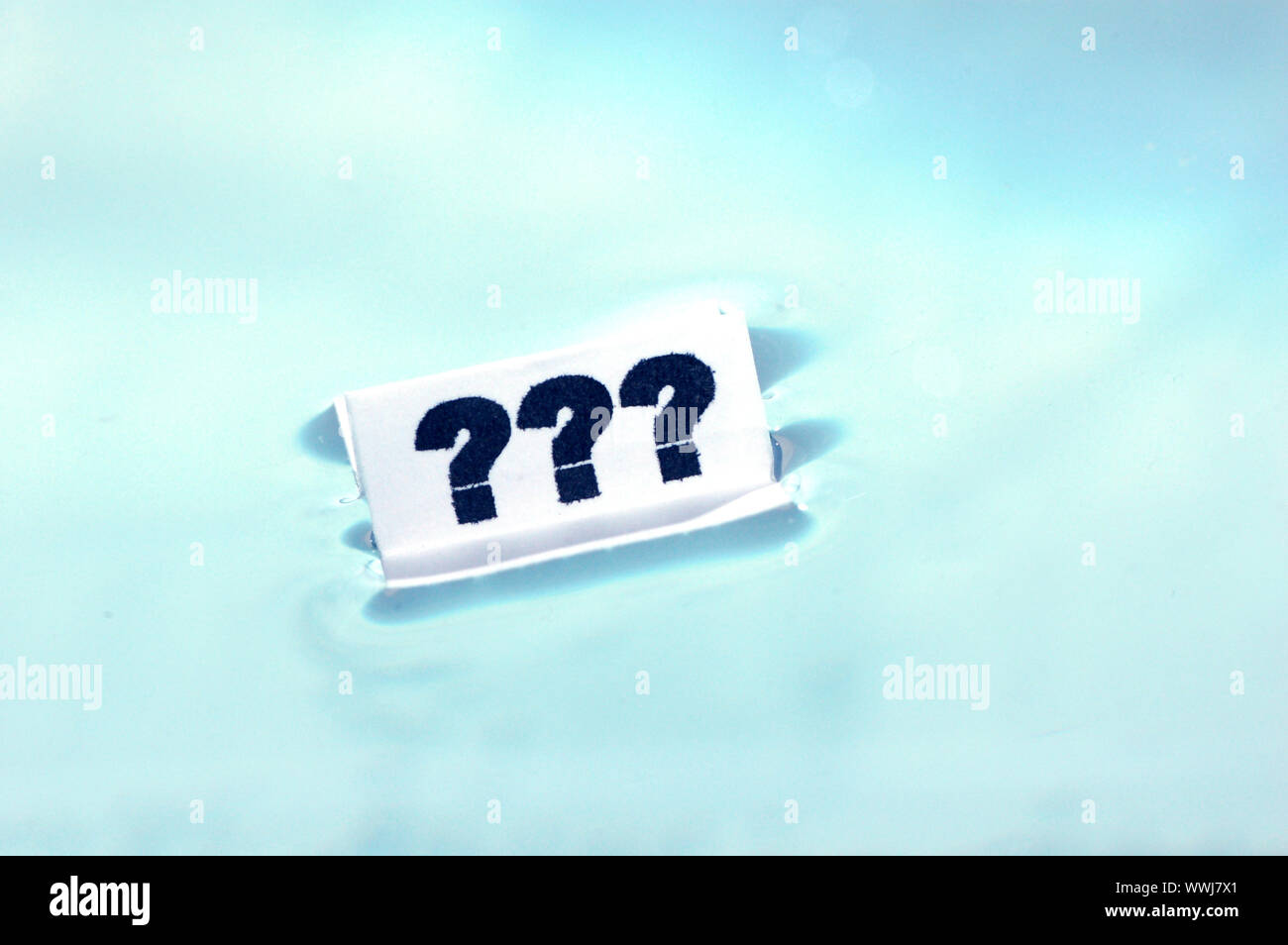 Card floating on water surface with printed Stock Photo - Alamy