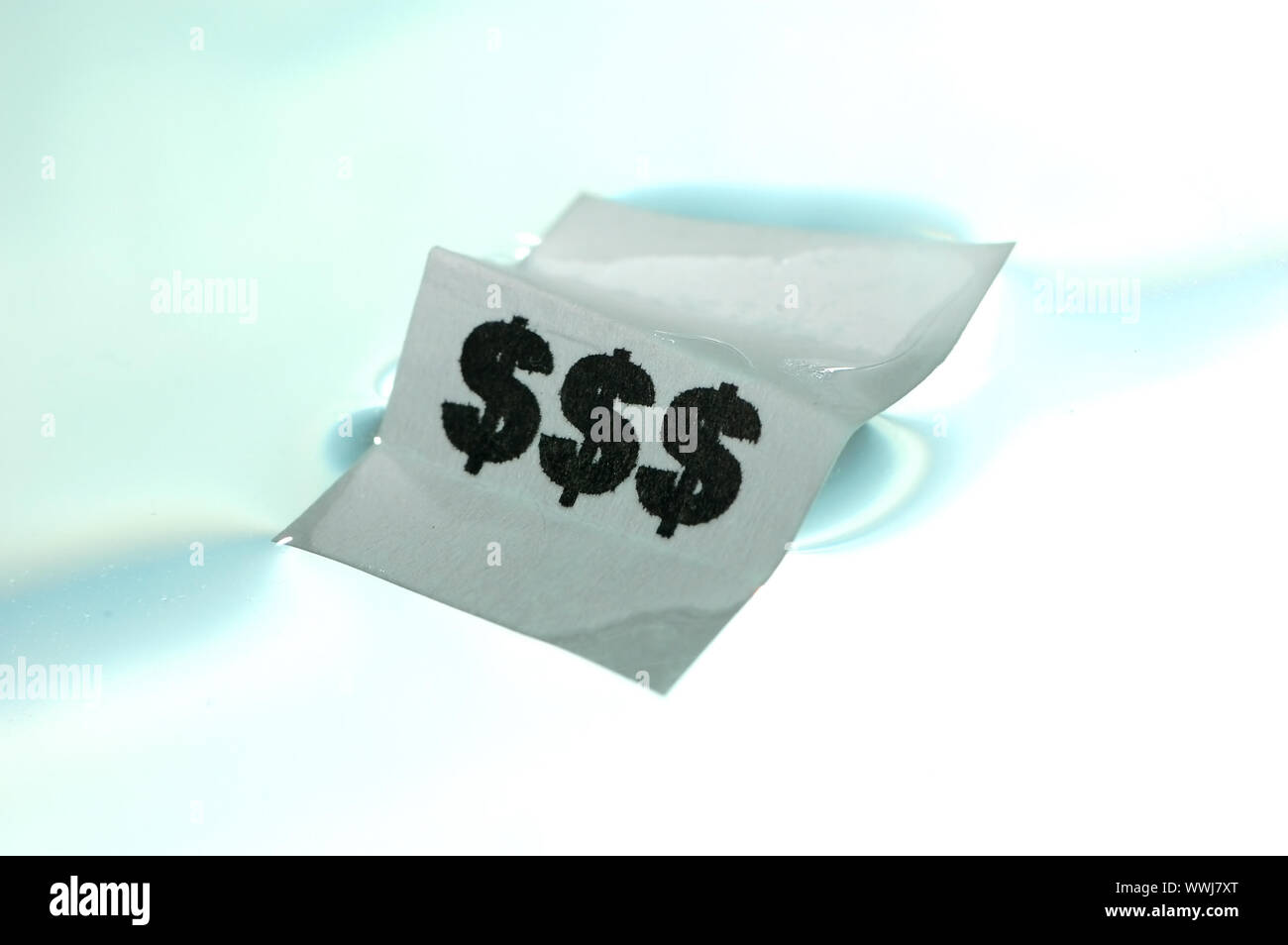 Card floating on water surface with printed: $$$ Stock Photo - Alamy