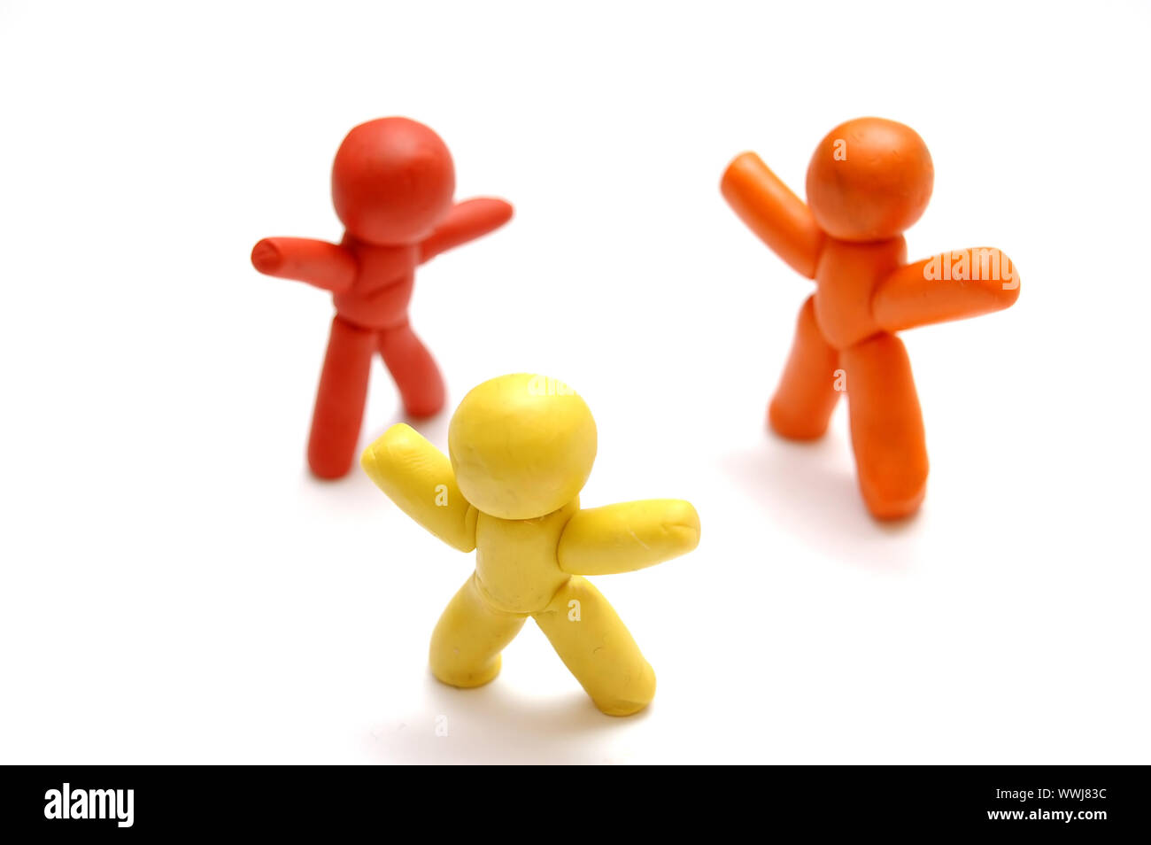 3 plasticine figures staying together and celebrating Stock Photo - Alamy