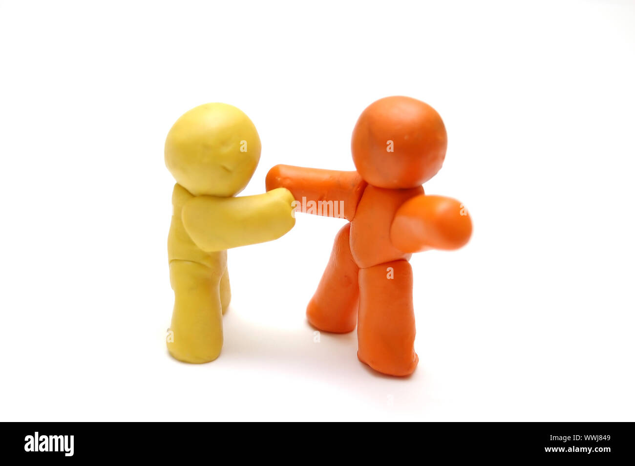 2 plasticine figures agreement and handshake Stock Photo - Alamy
