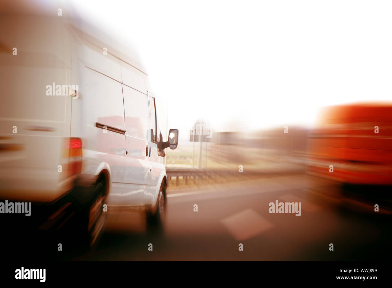 Transportation, logistics concept. Delivery vans, trucks on a freeway ...