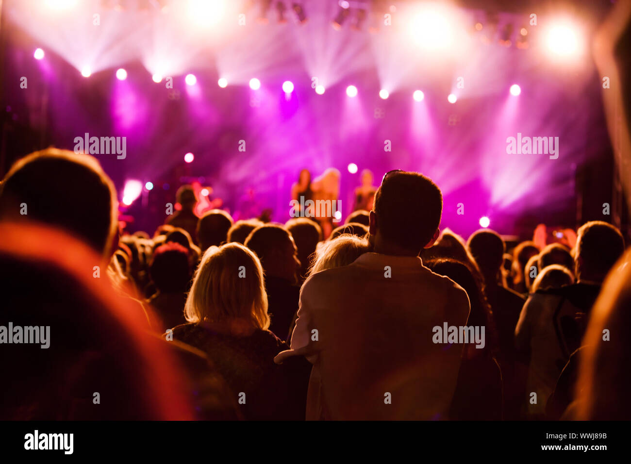 Crowds of people having fun on a music concert Stock Photo - Alamy
