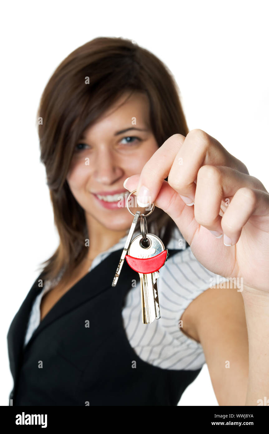 Smiling developer gives keys to new home. Isolated on white background ...